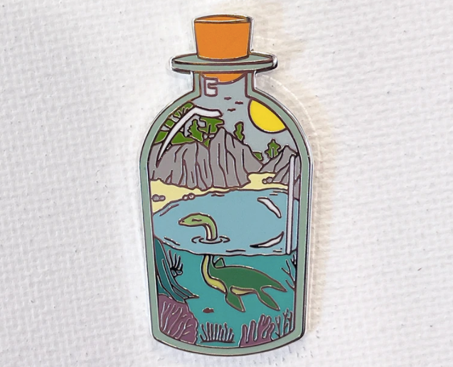Dinosaur Bottle Enamel Pin | Collins & Coupe